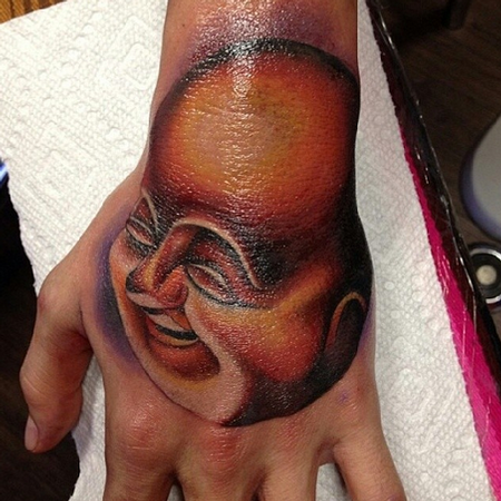 Buddhist Hand Tattoo