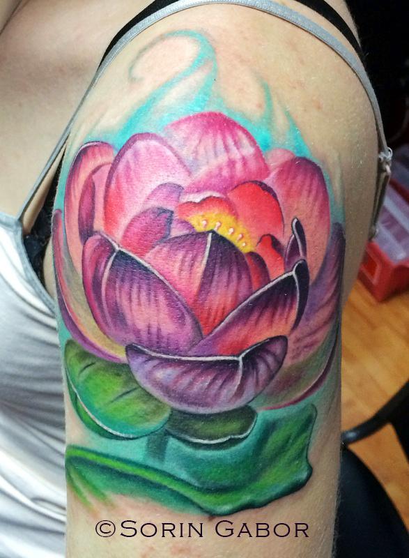 realistic color lotus tattoo on shoulder by Sorin Gabor : Tattoos